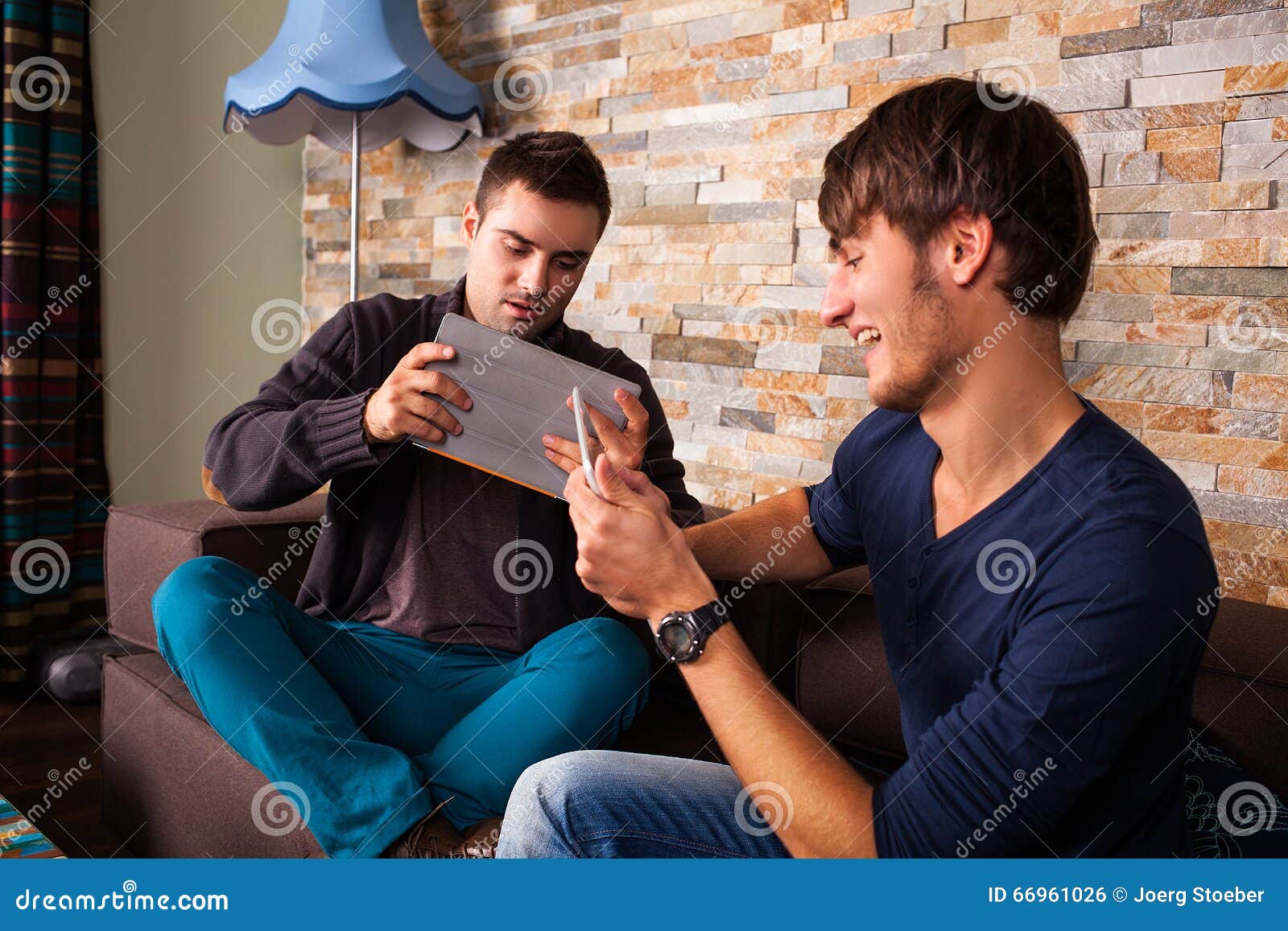 Two Friends Playing Together with Tablet Computers Stock Photo - Image ...