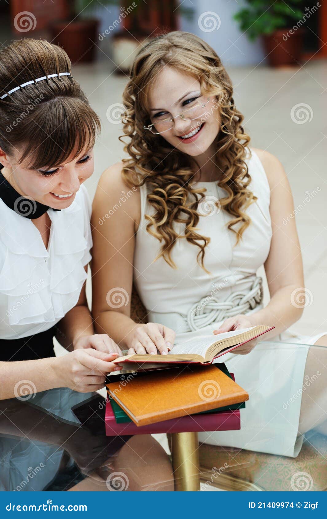 Two friends reading book stock photo. Image of glasses - 21409974