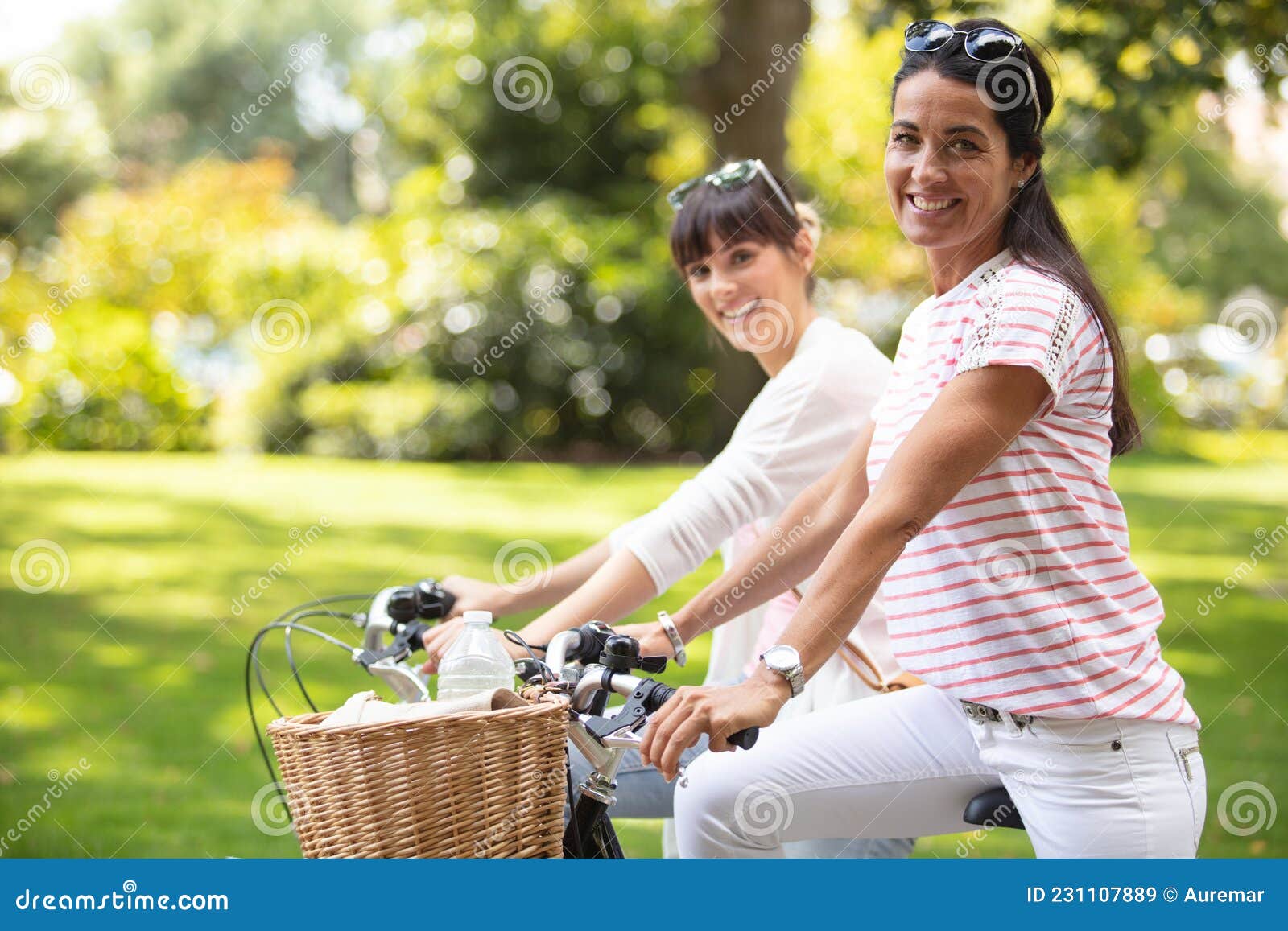 Two Friends Riding on Bikes in Countryside Stock Image - Image of ...