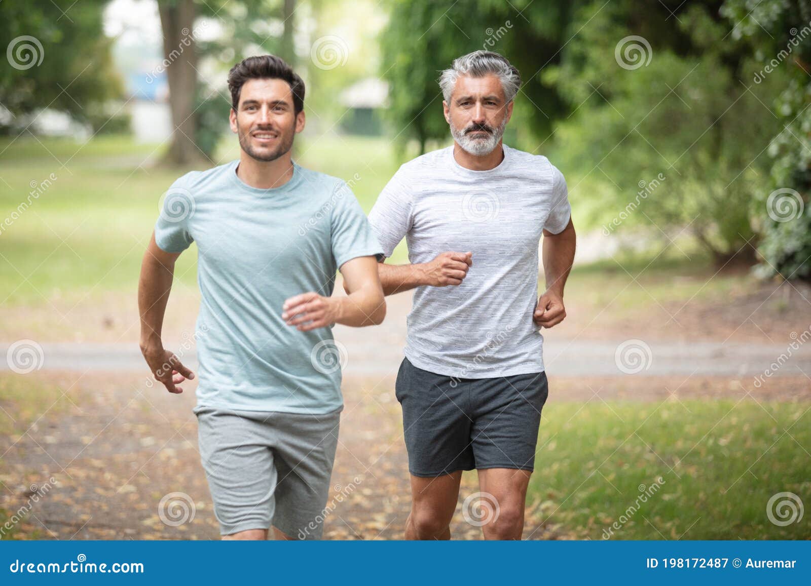 Two Friends Running through Forest on Jogging Trail Stock Image - Image ...