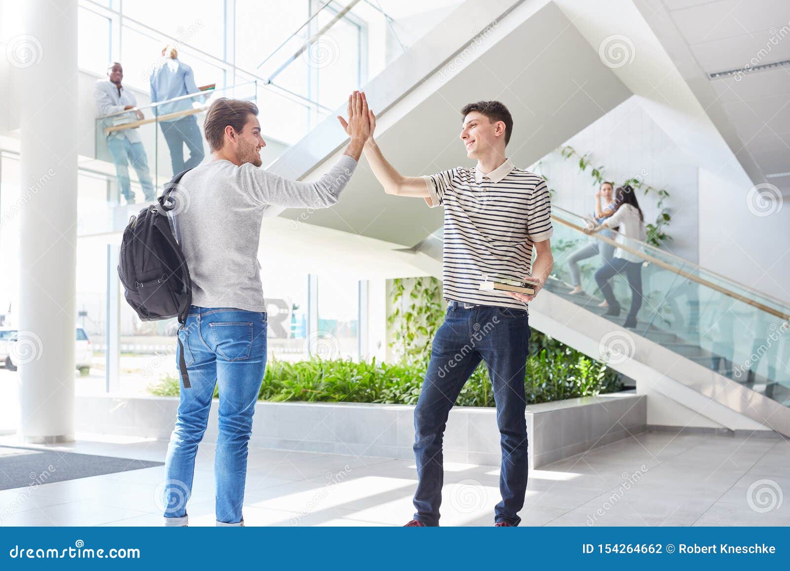 Two Friends Share High Five Stock Photo - Image of freshmen, hands ...