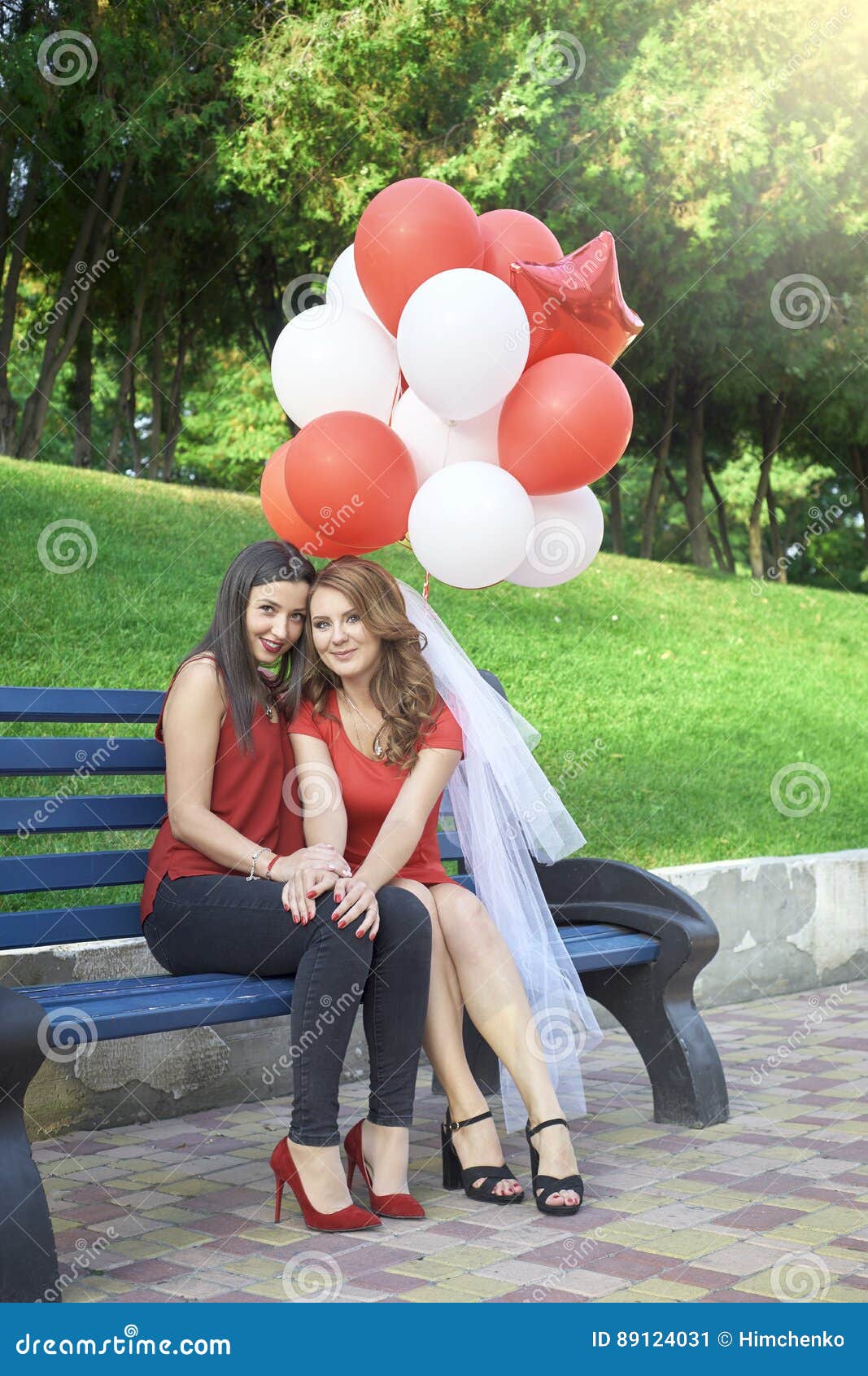 Two Friends Sitting on the Bench with Balls Stock Image - Image of ...
