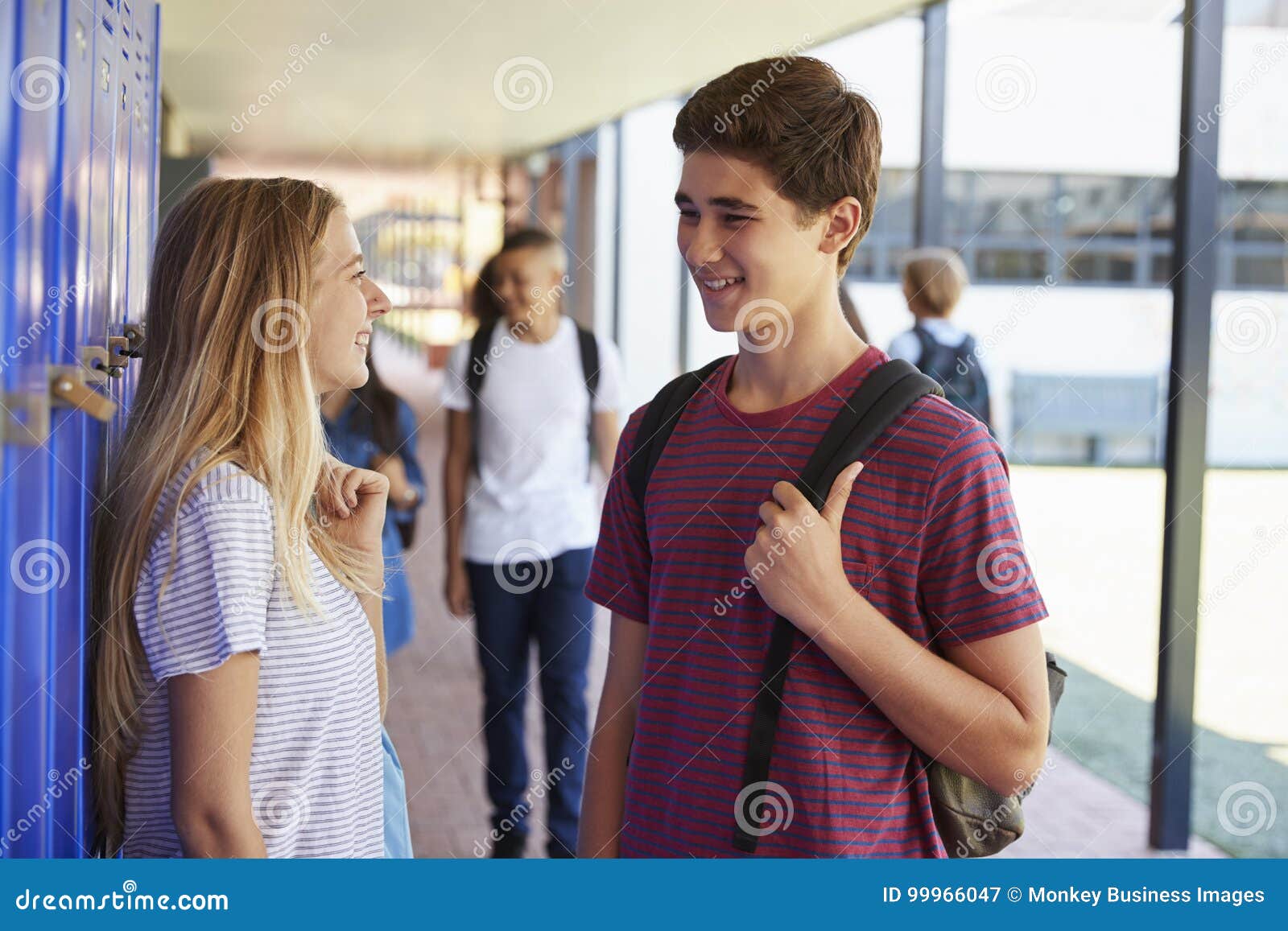Two Friends Talking in School Corridor at Break Time Stock Image ...