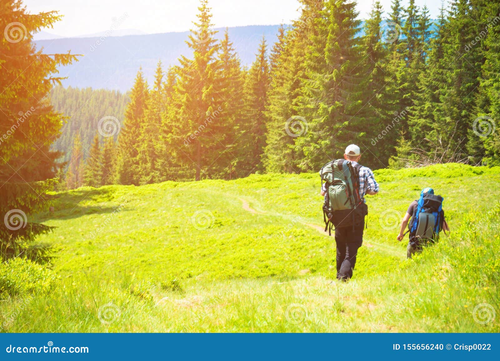 Two Friends Travel in Mountains with Backpacks Stock Photo - Image of ...