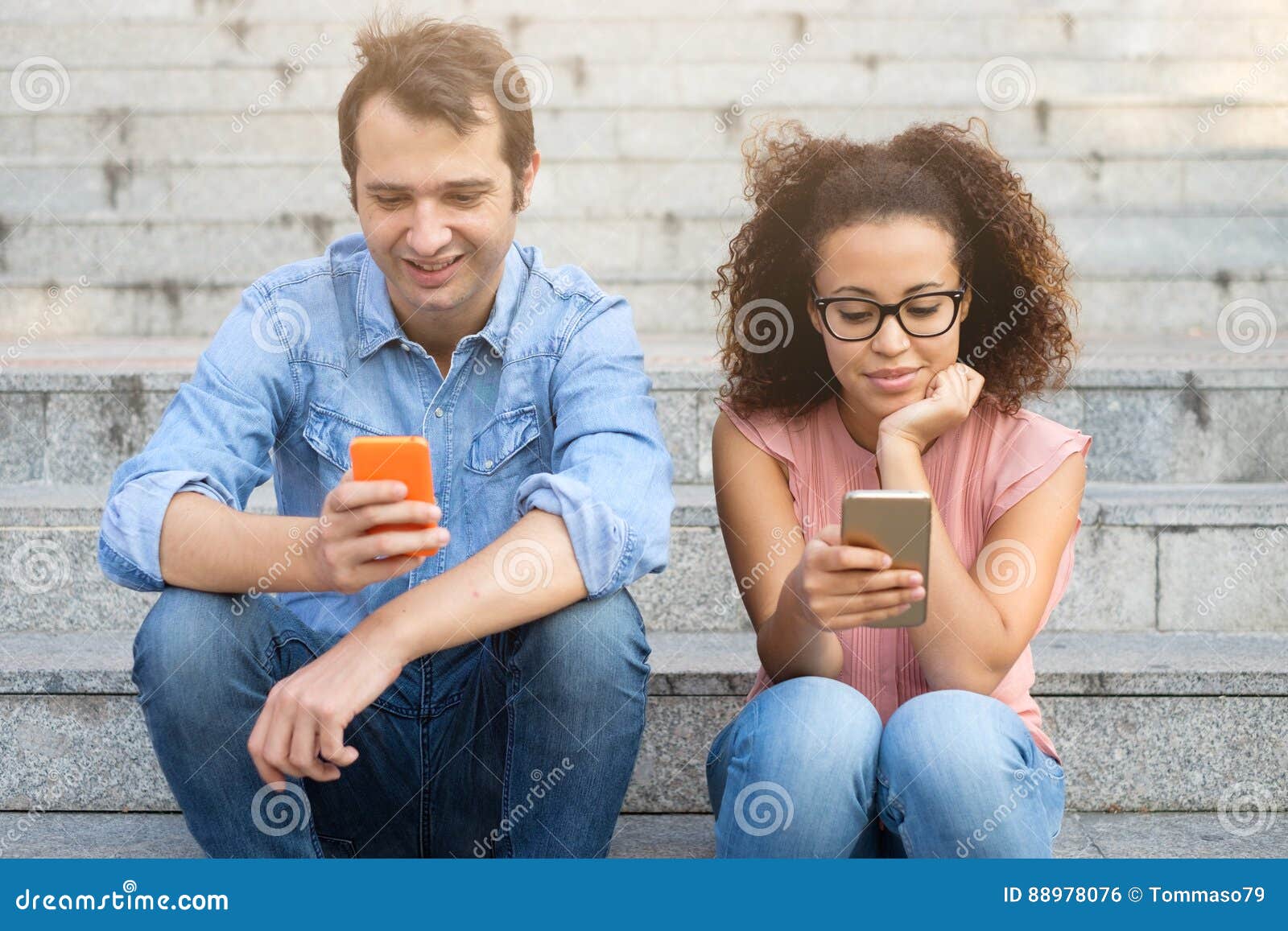 Two Friends Using Their Mobile Phones Seated Stock Photo - Image of ...