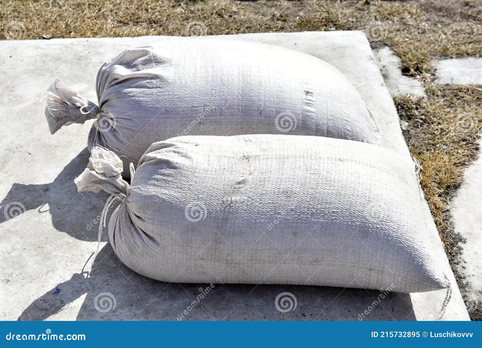 Two Full Sacks of Grain on the Ground in the Yard Stock Image - Image ...