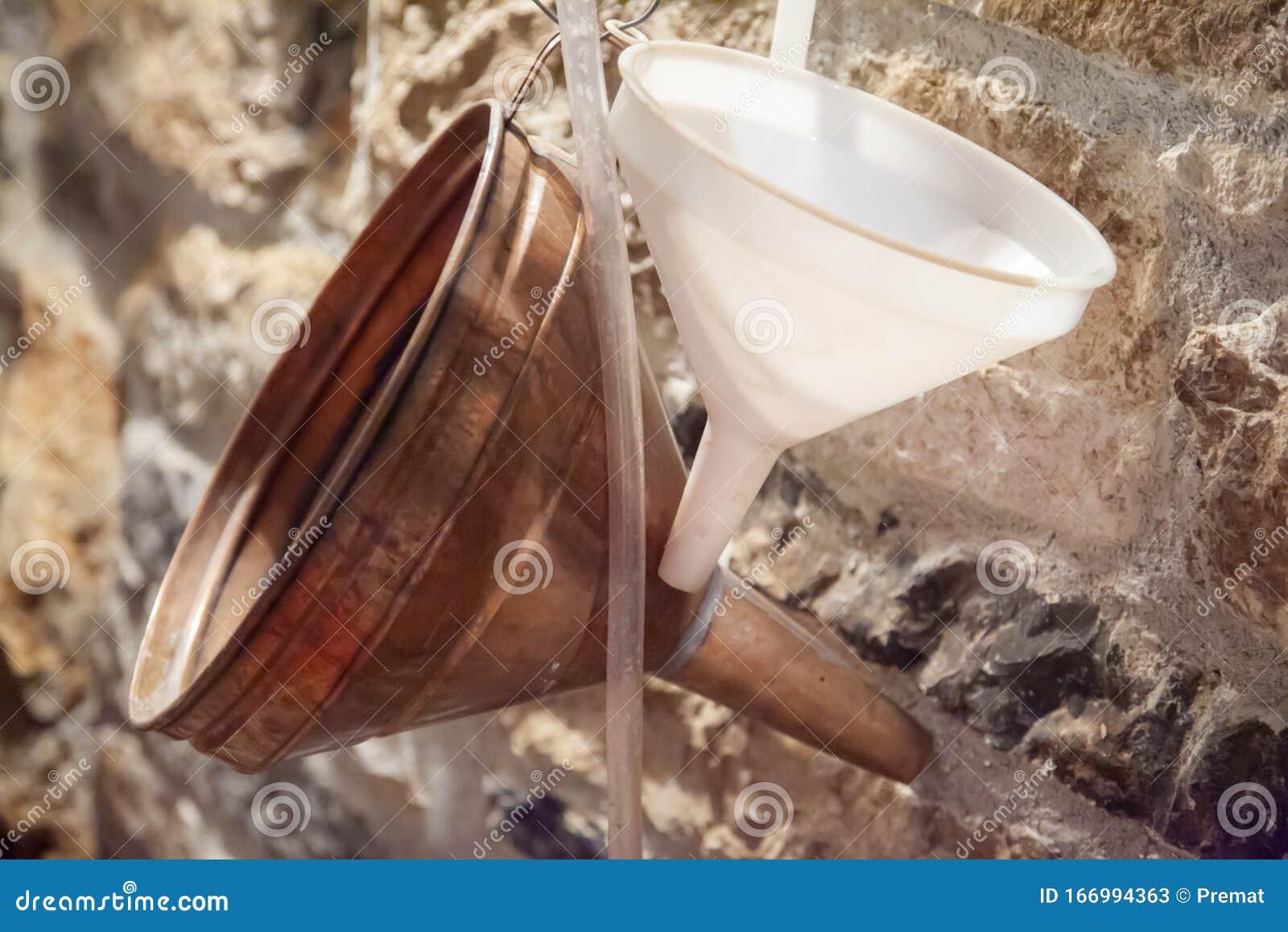 Two funnels on the wall stock image. Image of beverage - 166994363
