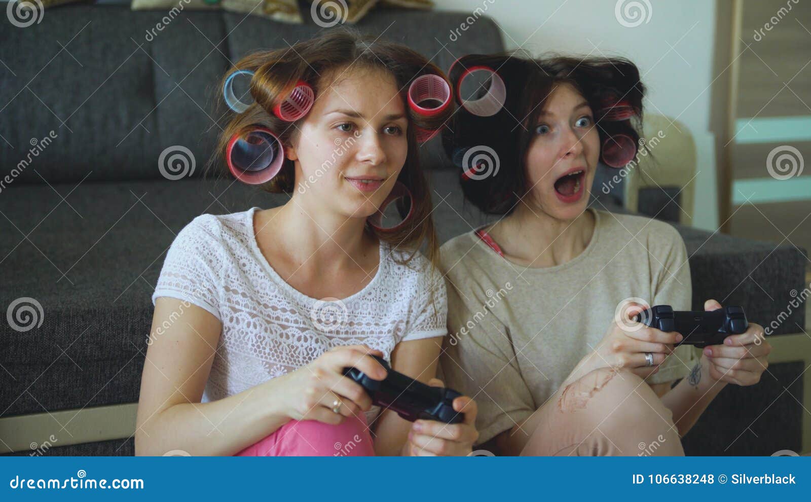Two Funny Women Play Console Games with Gamepad and Have Fun at Home ...