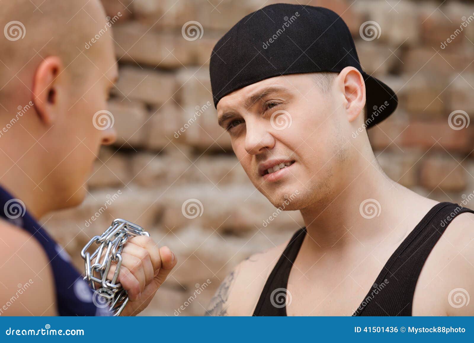 Two Gangsters Talking on Brick Wall Background. Stock Photo - Image of ...