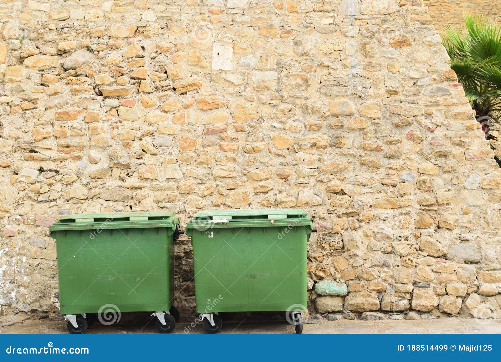 Old wall with two garbage stock image. Image of container - 188514499