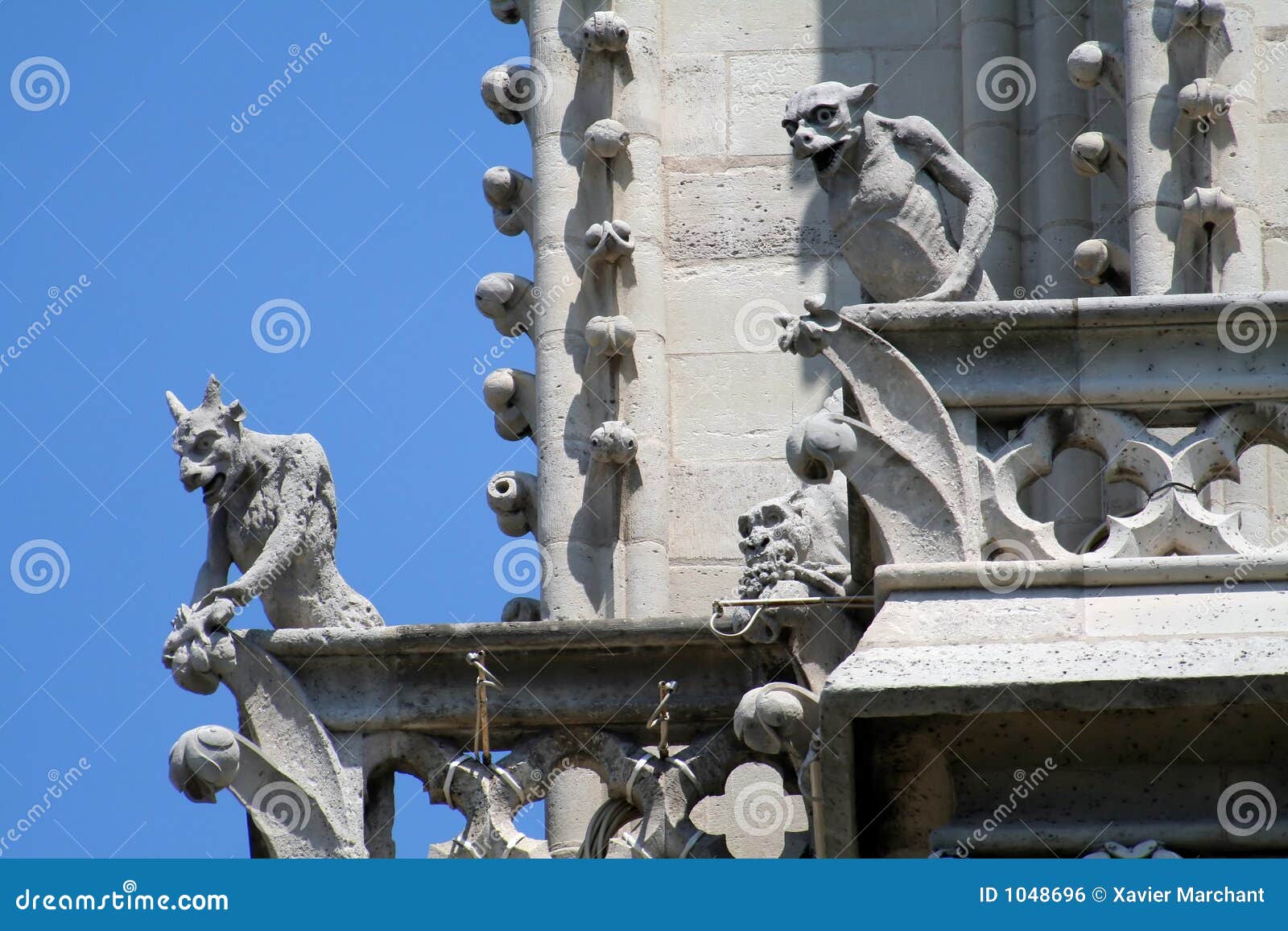Two gargoyles on a balcony stock photo. Image of france - 1048696