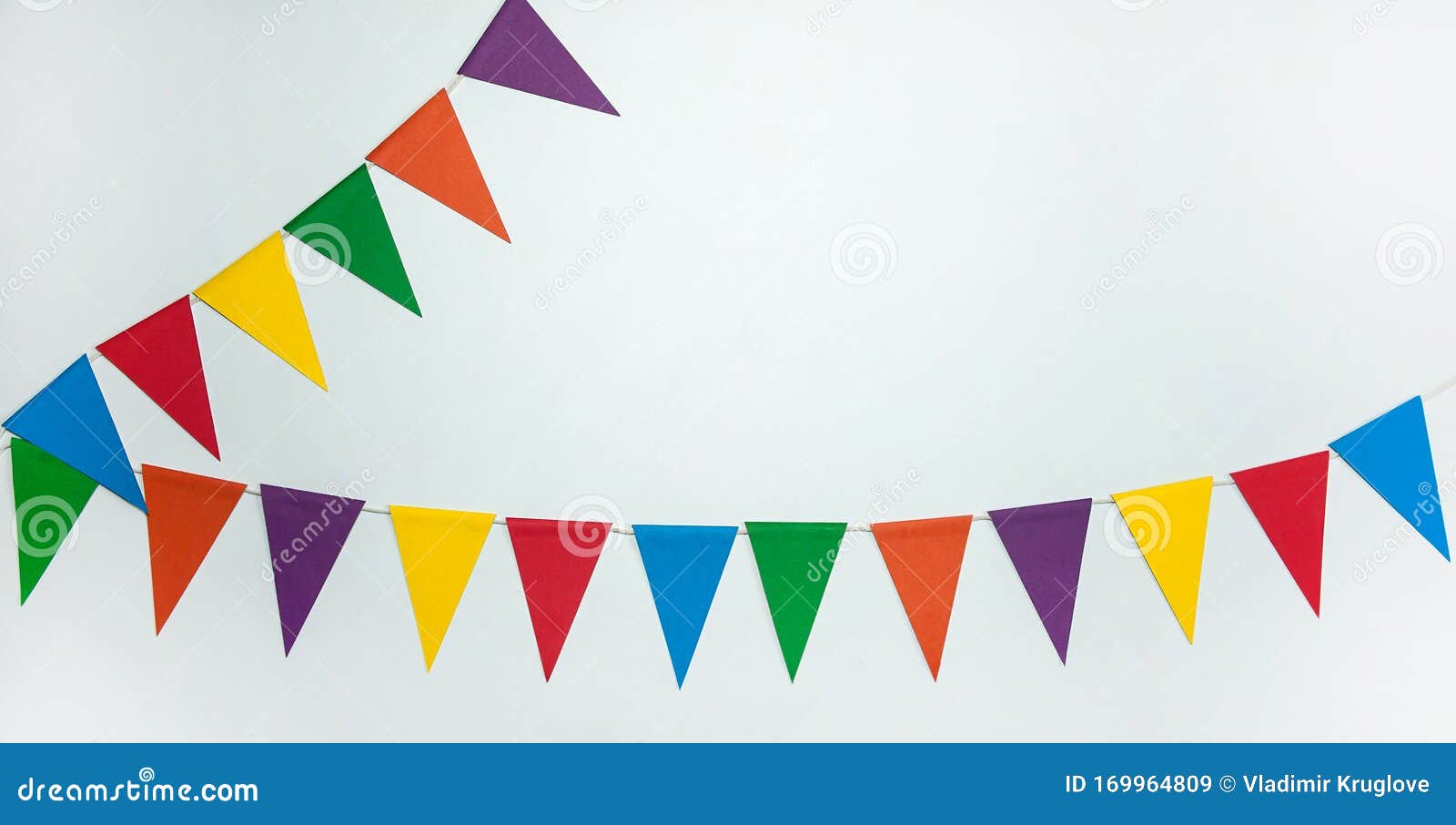Two Garlands of Multi-colored Triangle Paper Flags on a White ...