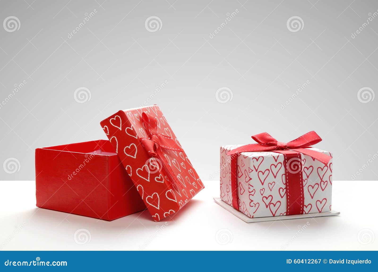 Two Gift Boxes with Hearts Printed with Grey Background Front Stock ...