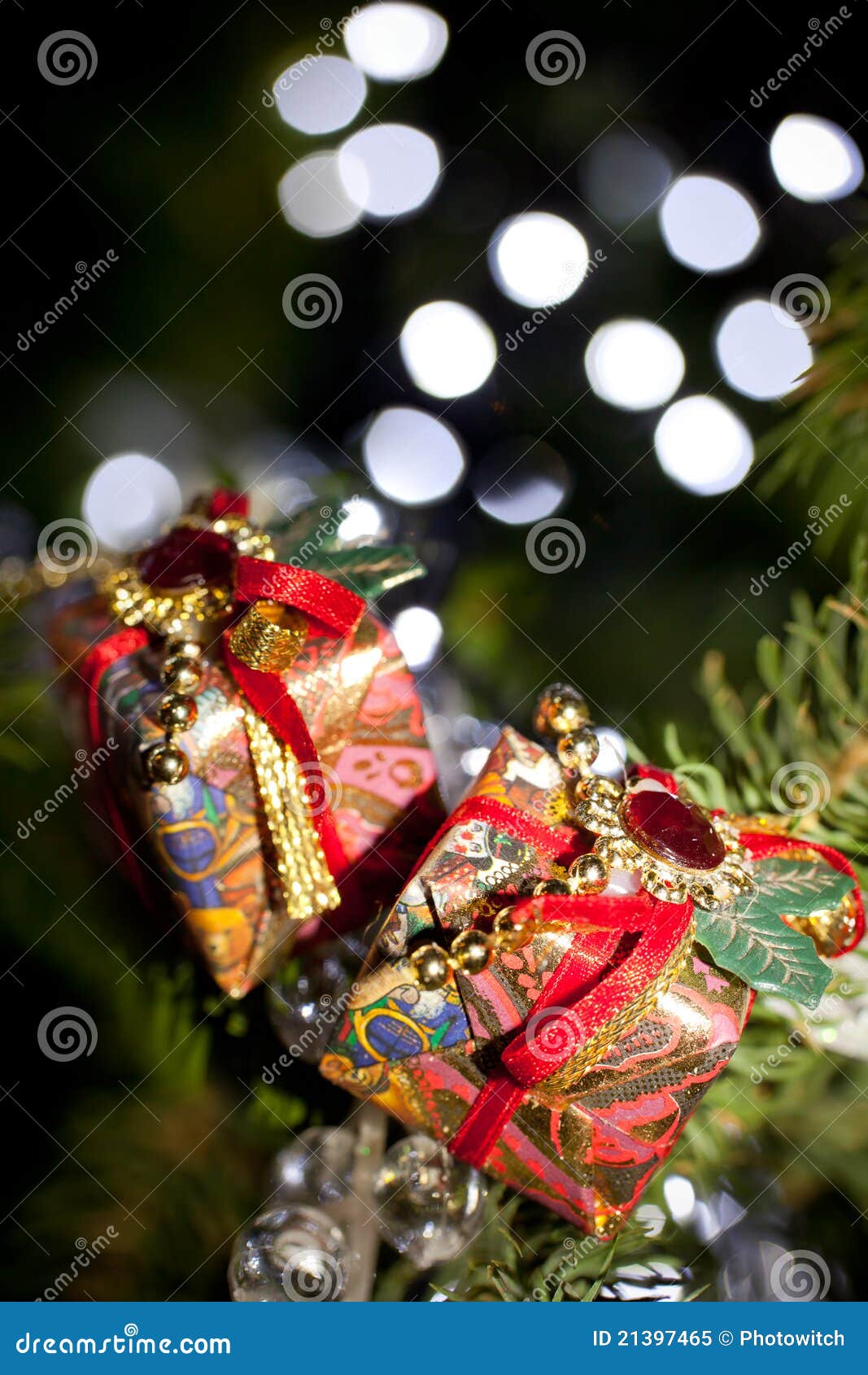 Two Gifts in a Christmas Tree Stock Image - Image of closeup, lights ...