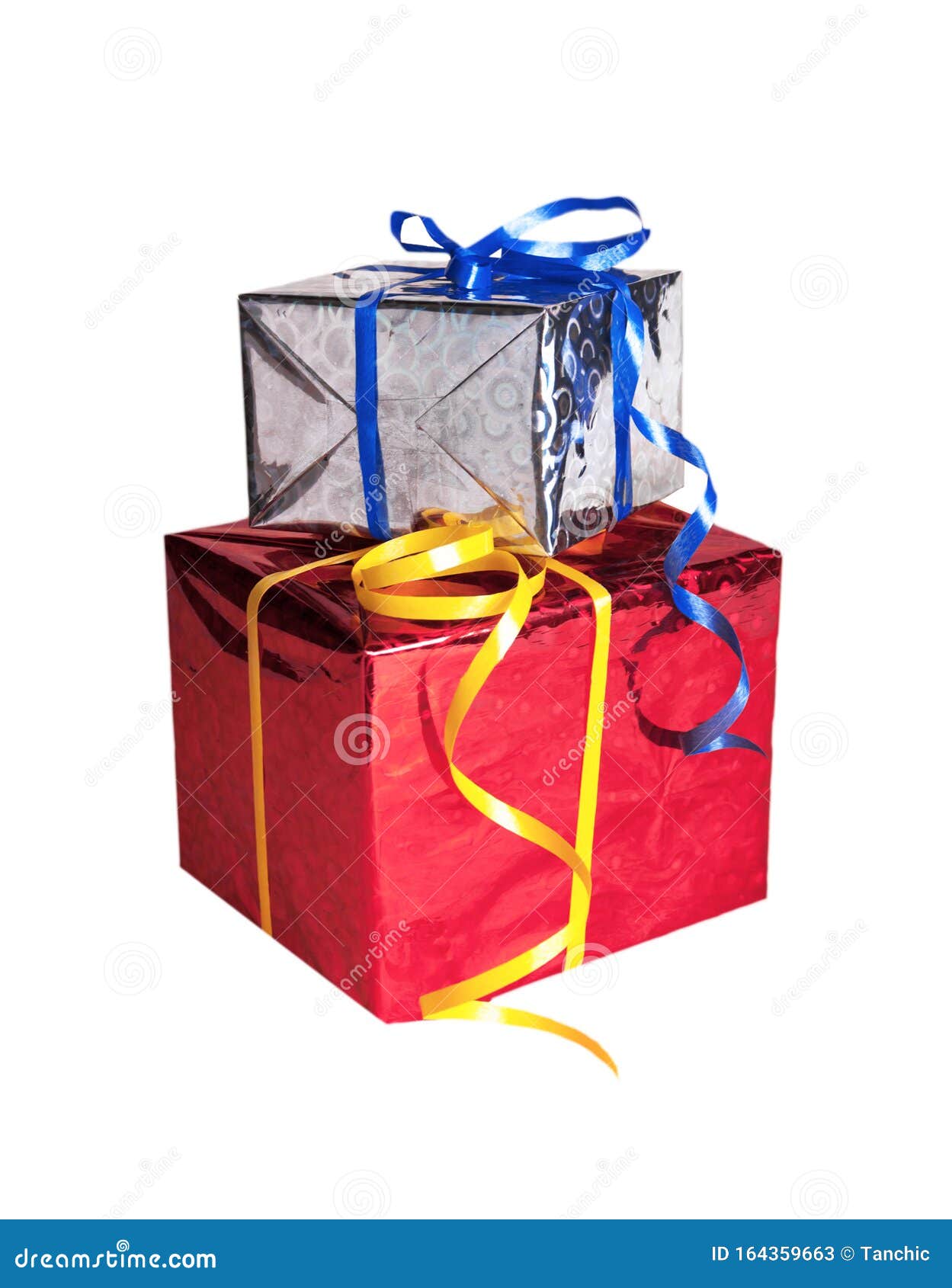 Two Gifts in Red and Silver Packaging Stand on Top of Each Other ...