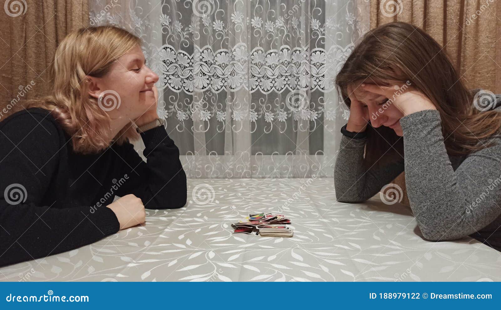 Girl Friends Play Uno Cards at Table Editorial Photography - Image of ...