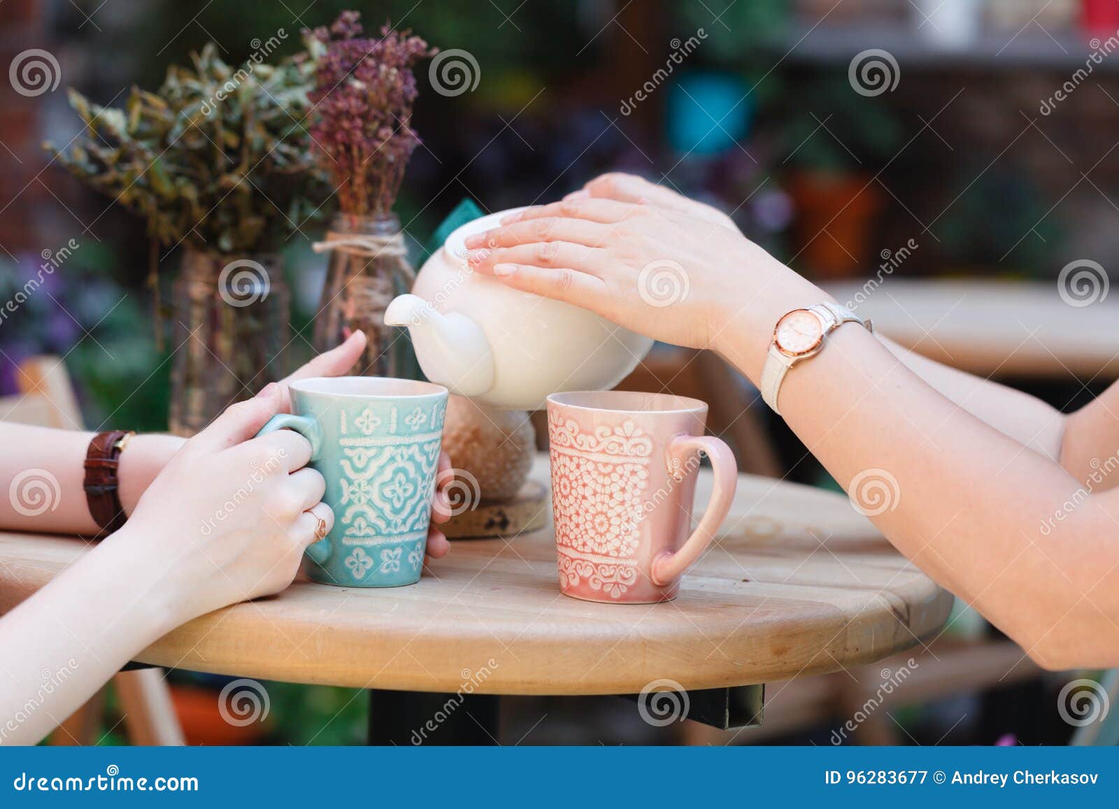 Two Girl-friends Talk and Drink Tea in Cafe, Outdoors Stock Image ...