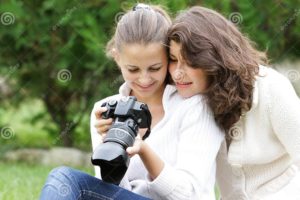 Two Girl Looking with Digital Camera Stock Photo - Image of artist ...