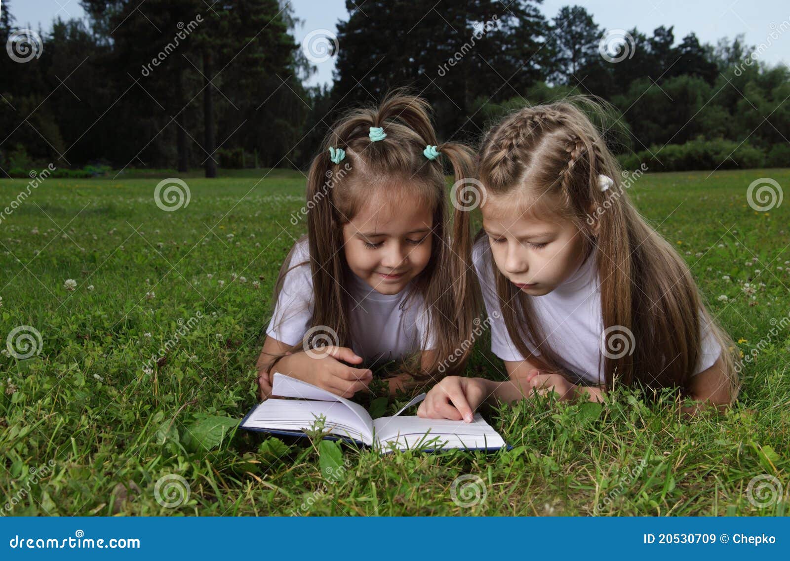 Two girl read book stock image. Image of learning, childhood - 20530709