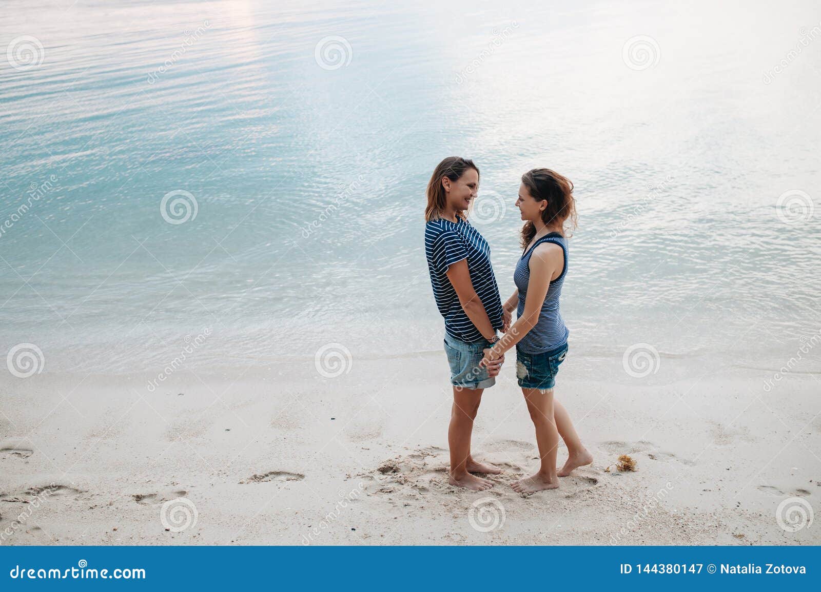 Two Girlfriends Hugging Each Other On The Beach Stock Image Image Of
