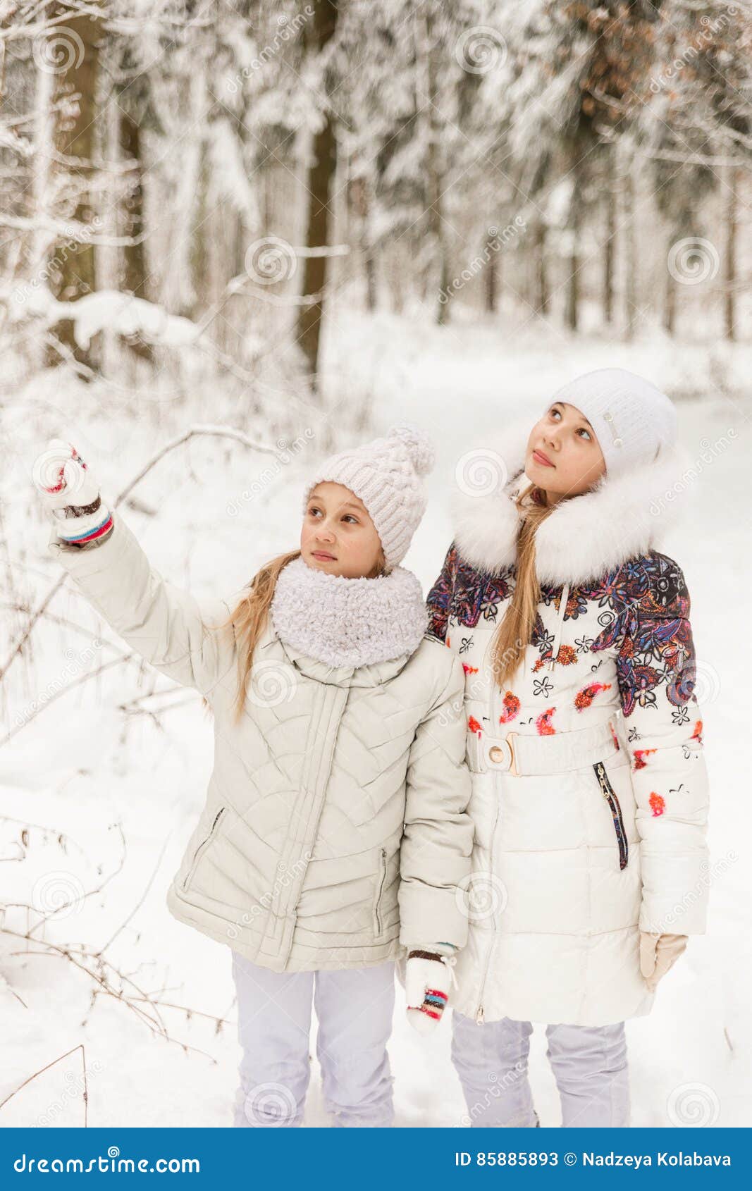 Two Girlfriends Playing in a Winter Forest. Stock Image - Image of ...