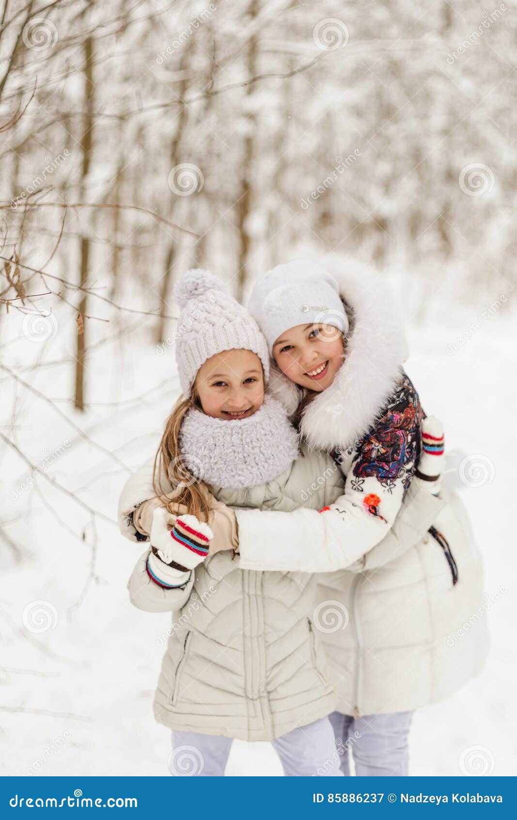Two Girlfriends Playing in a Winter Forest. Stock Image - Image of ...