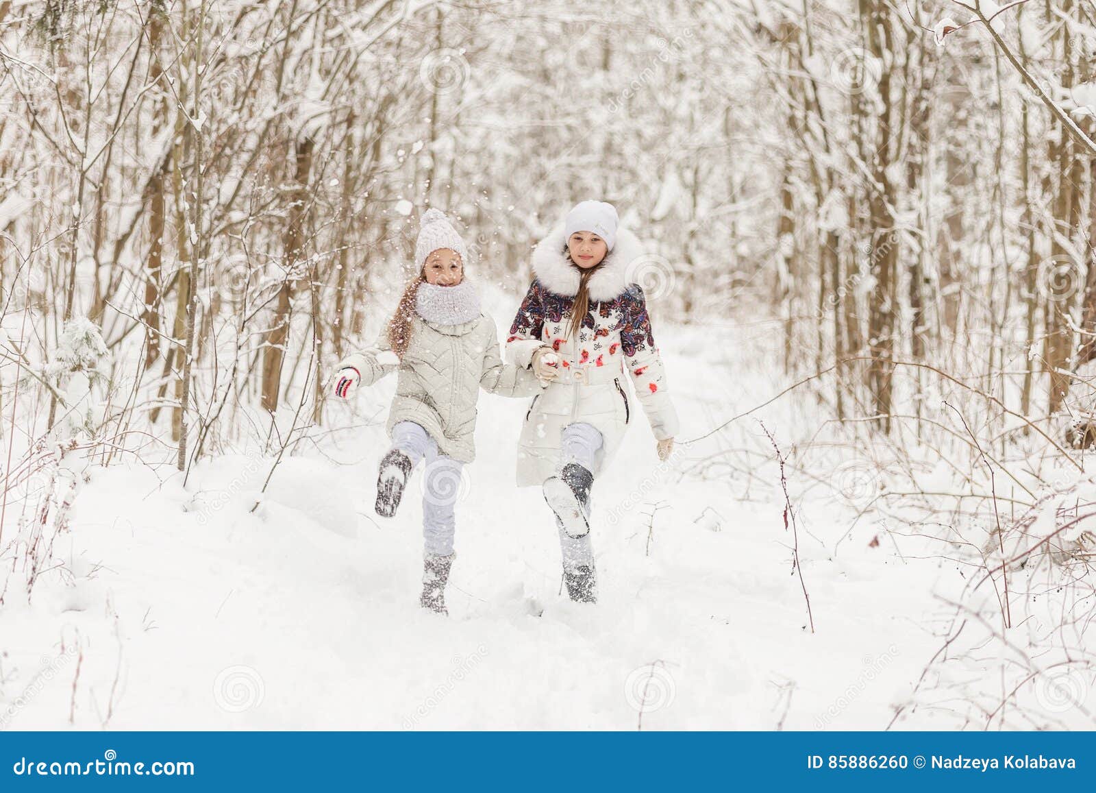 Two Girlfriends Playing in a Winter Forest. Stock Photo - Image of ...