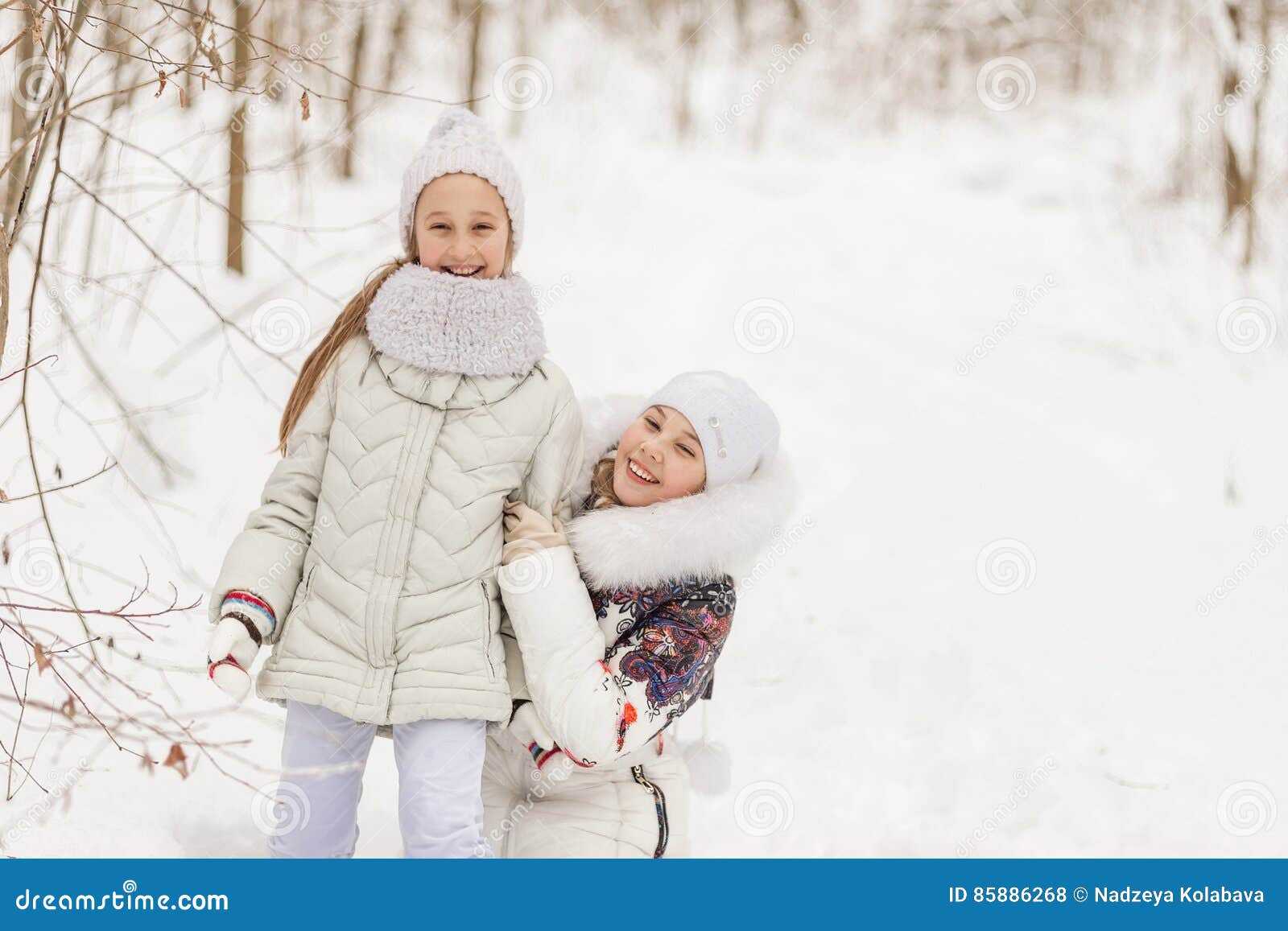 Two Girlfriends Playing in a Winter Forest. Stock Photo - Image of ...