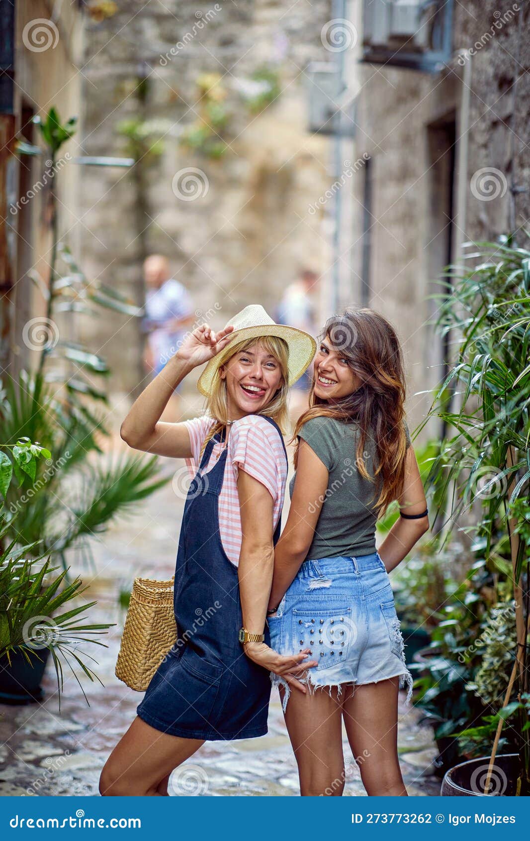 Two Girlfriends On Strret Making Funny Face Expressions Having Fun