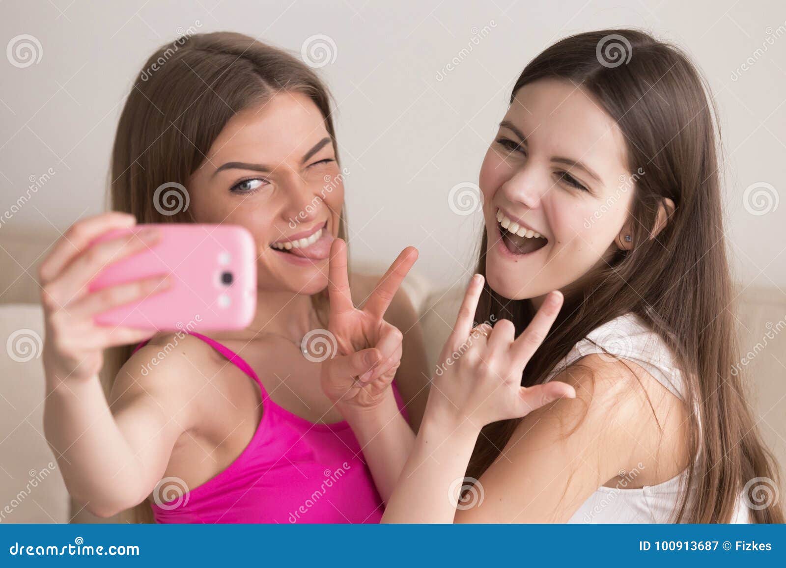 Two Young Happy Girlfriends Taking Selfie With Smartphone Stock Image