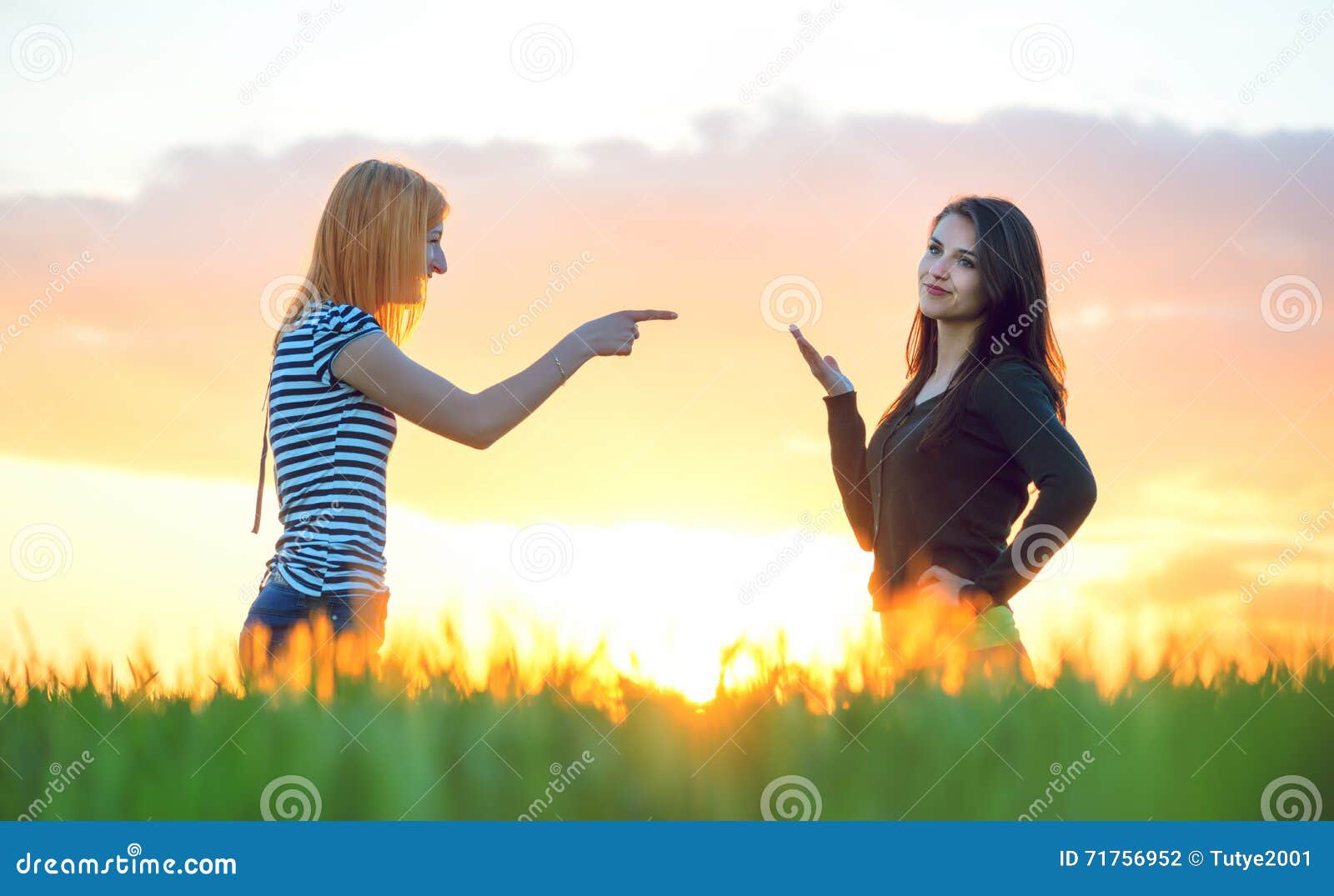 Two Girls Arguing Pointing a Finger and Ignoring in the Nature Stock ...