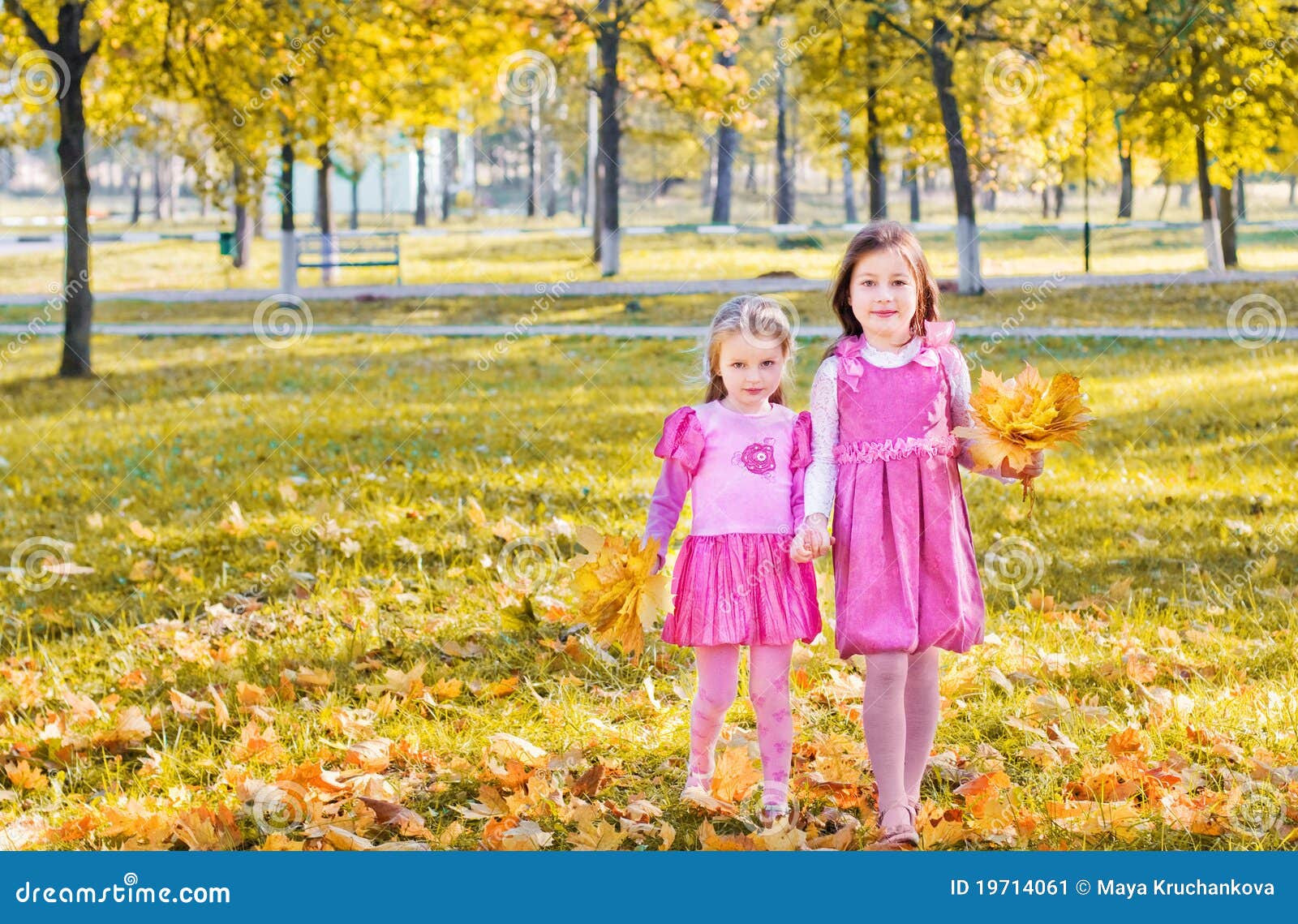 Two girls in autumn park stock image. Image of family - 19714061