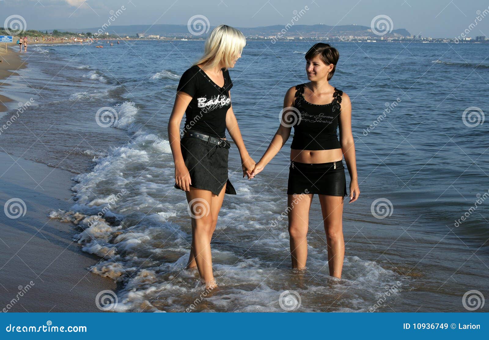 Two girls on a beach stock image. Image of young, human - 10936749