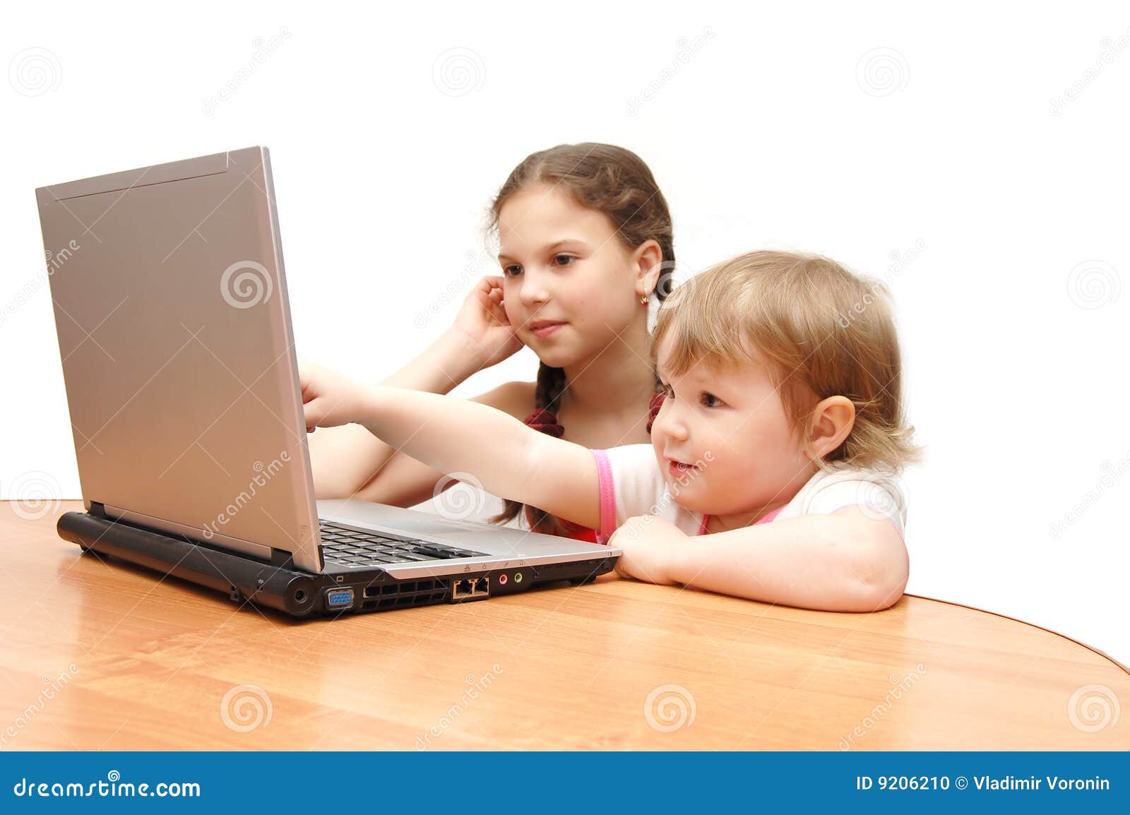 Two Girls Behind the Laptop Stock Photo - Image of little, expression ...