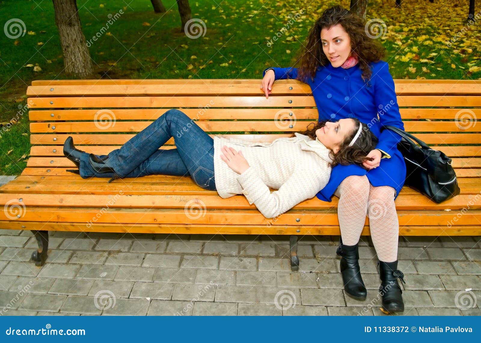 Two girls on the bench stock photo. Image of caucasian - 11338372