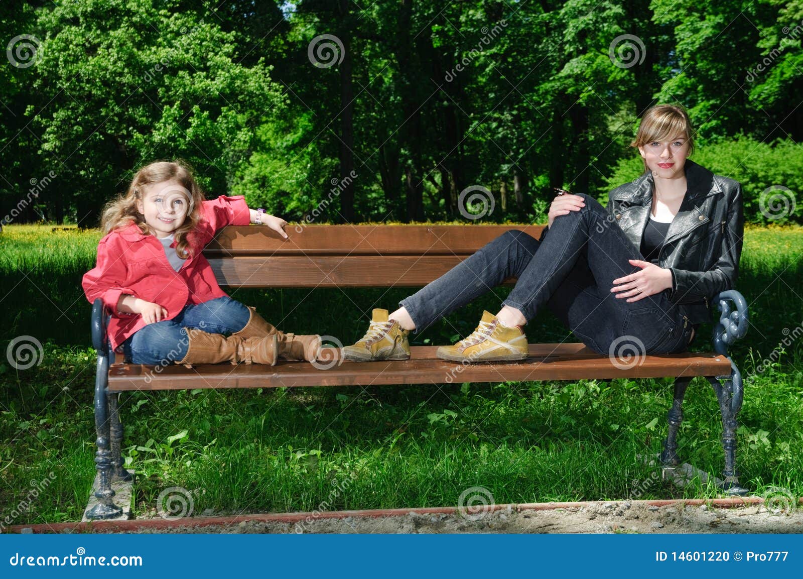Two girls on the bench stock photo. Image of family, people - 14601220