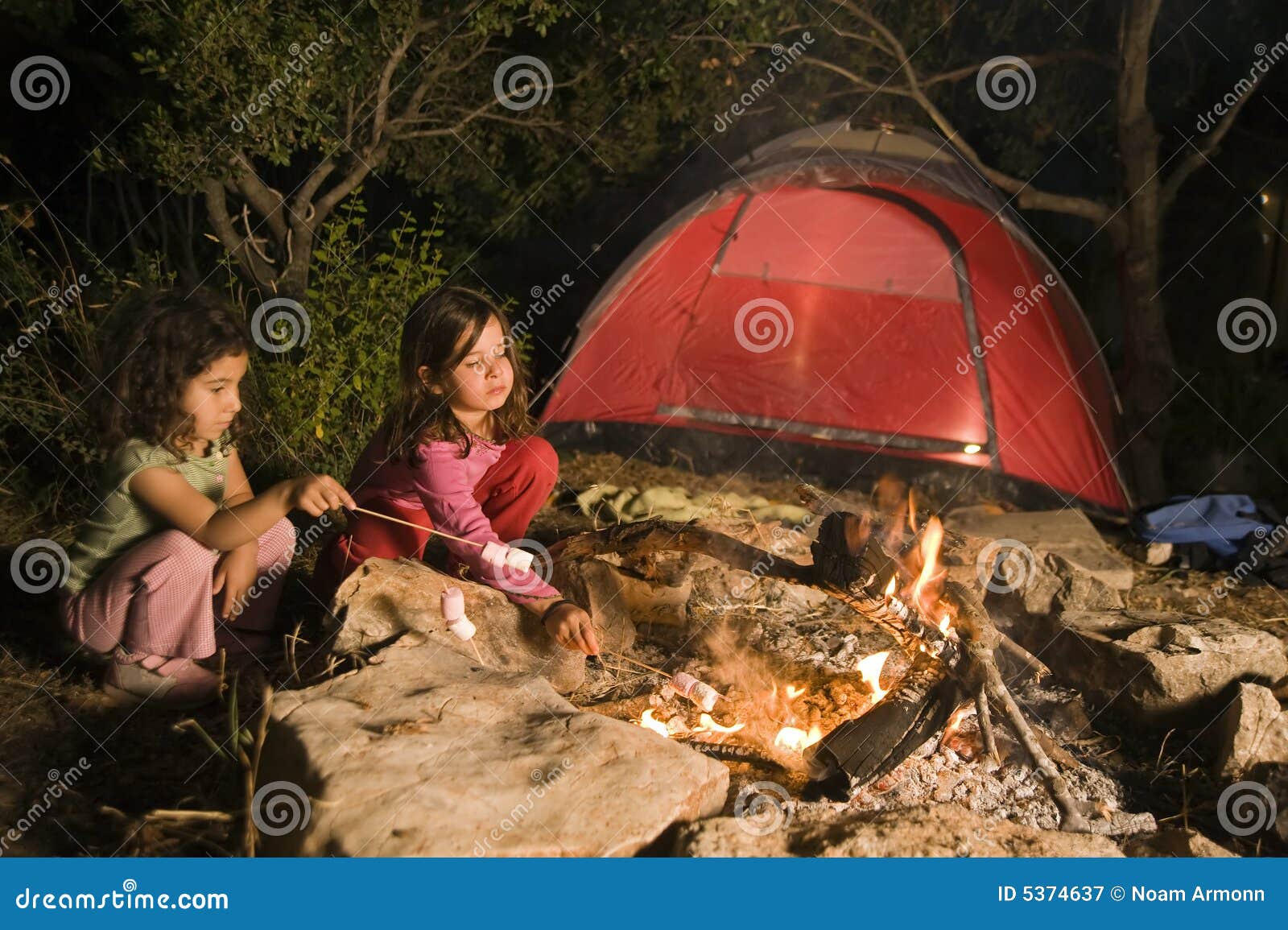 Two girls at a bonfire stock image. Image of beautiful - 5374637