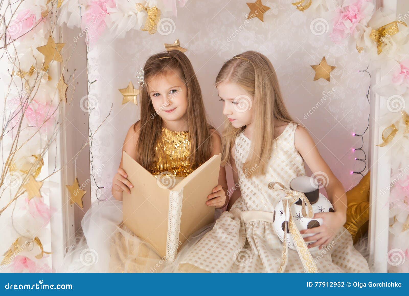 Two girls with a book stock photo. Image of merry, lace - 77912952