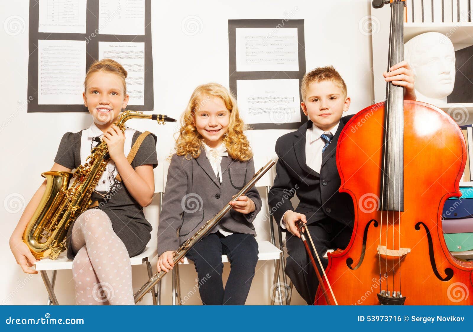 Two Girls and Boy Playing Musical Instruments Stock Photo - Image of ...