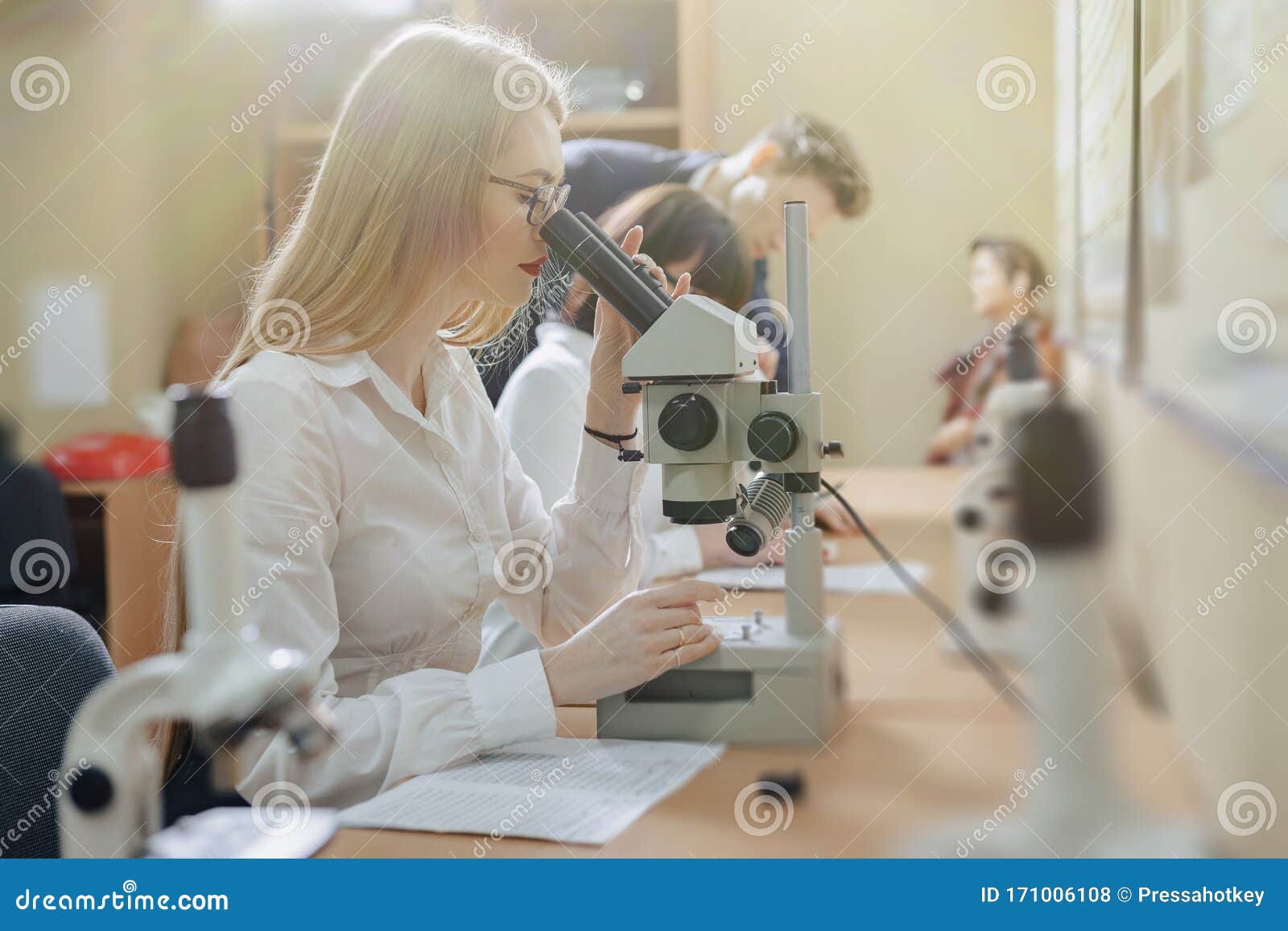 Two Girls and a Boy Work with Microscopes Stock Photo - Image of ...