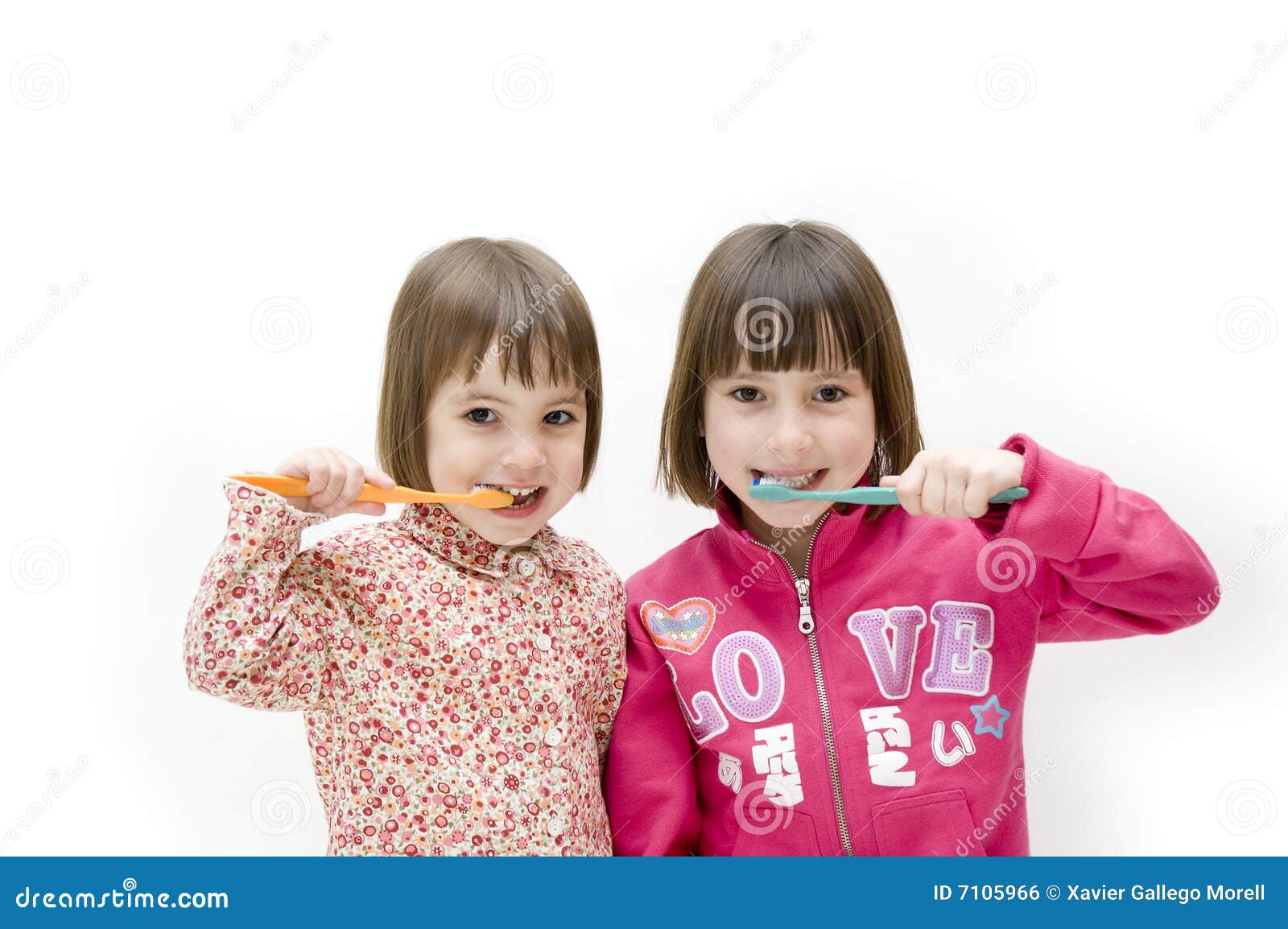 Two Girls Brushing His Teeth Stock Photo - Image of lovely, girl: 7105966
