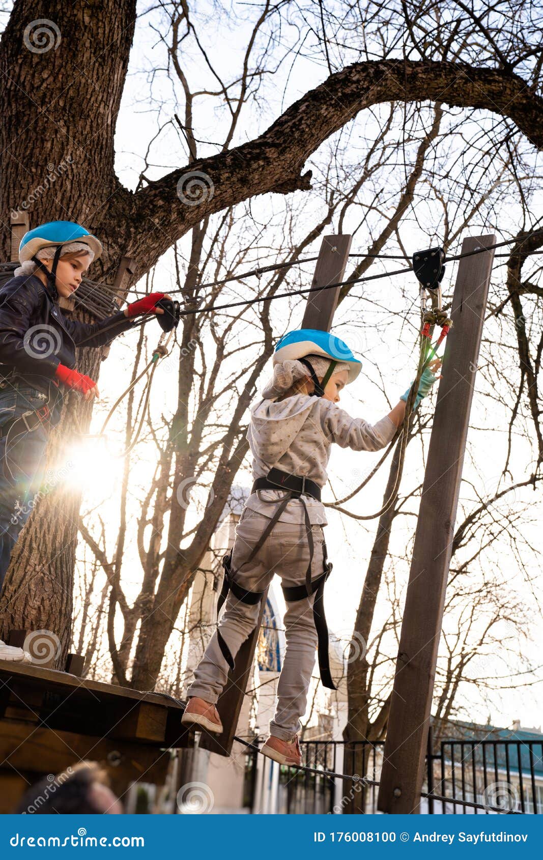Two Girls Climb in Rope Park in the Spring Stock Photo - Image of ...