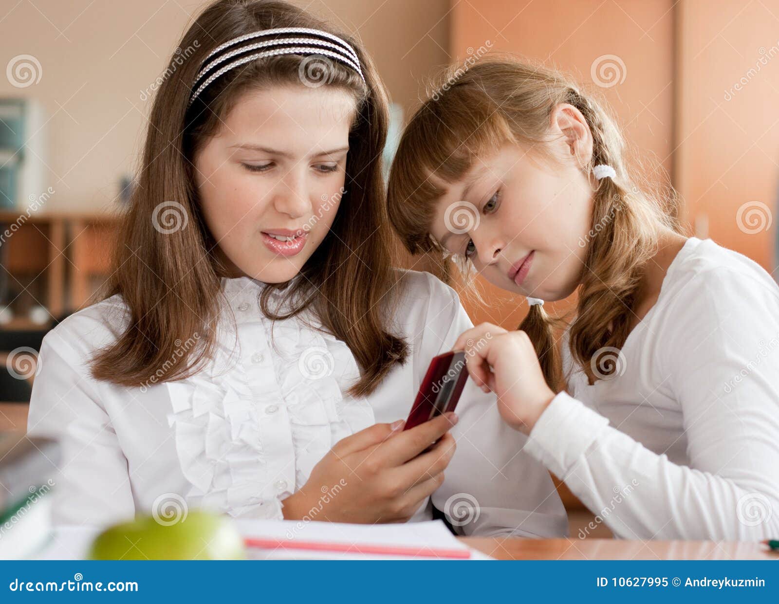 Two Girls Communicating in Classroom Stock Image - Image of chatting ...