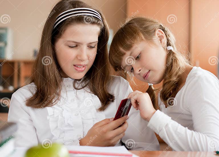 Two Girls Communicating in Classroom Stock Image - Image of chatting ...