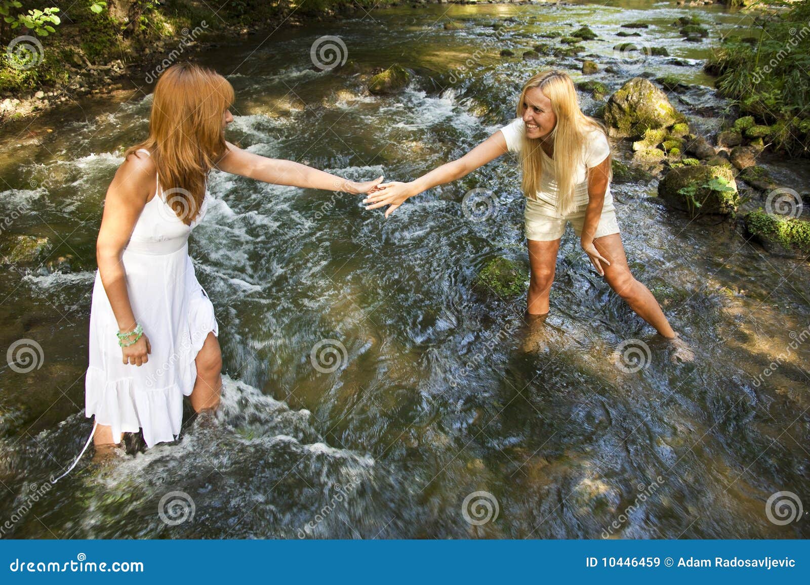 Two Girls Crossing the Stream Stock Image - Image of couple, group ...