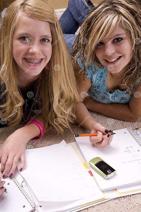 Two girls doing homework stock image. Image of homework - 10847735