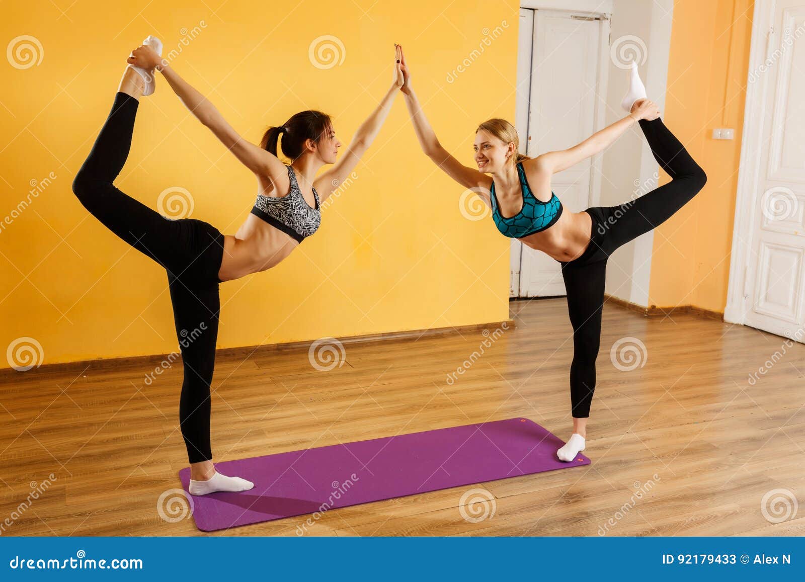 Two Girls Doing Stretching Exercises Stock Image - Image of adult, girl ...