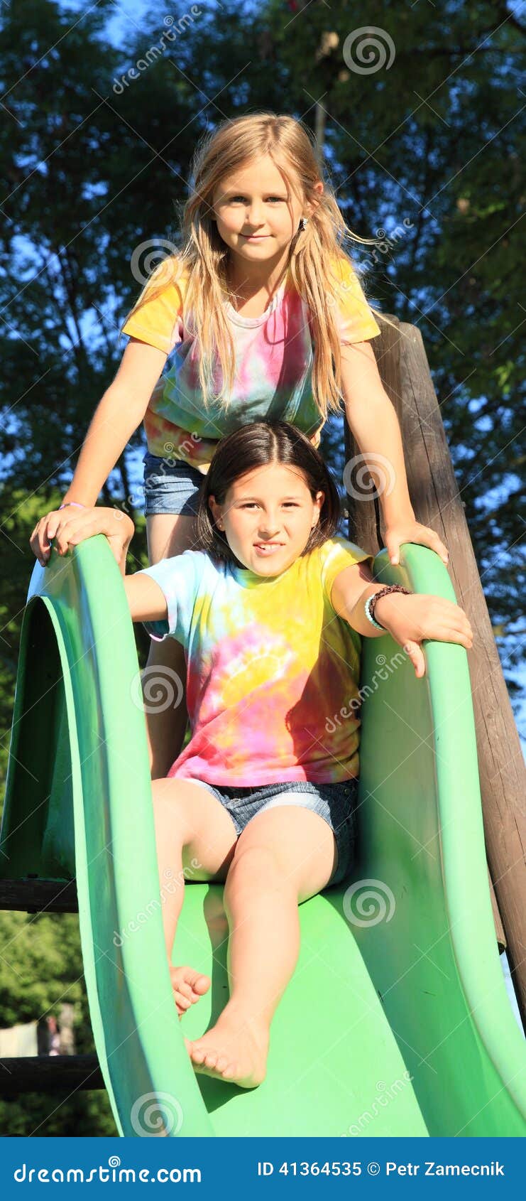 Two Girls Having Rest on Slide Stock Image - Image of beautiful ...