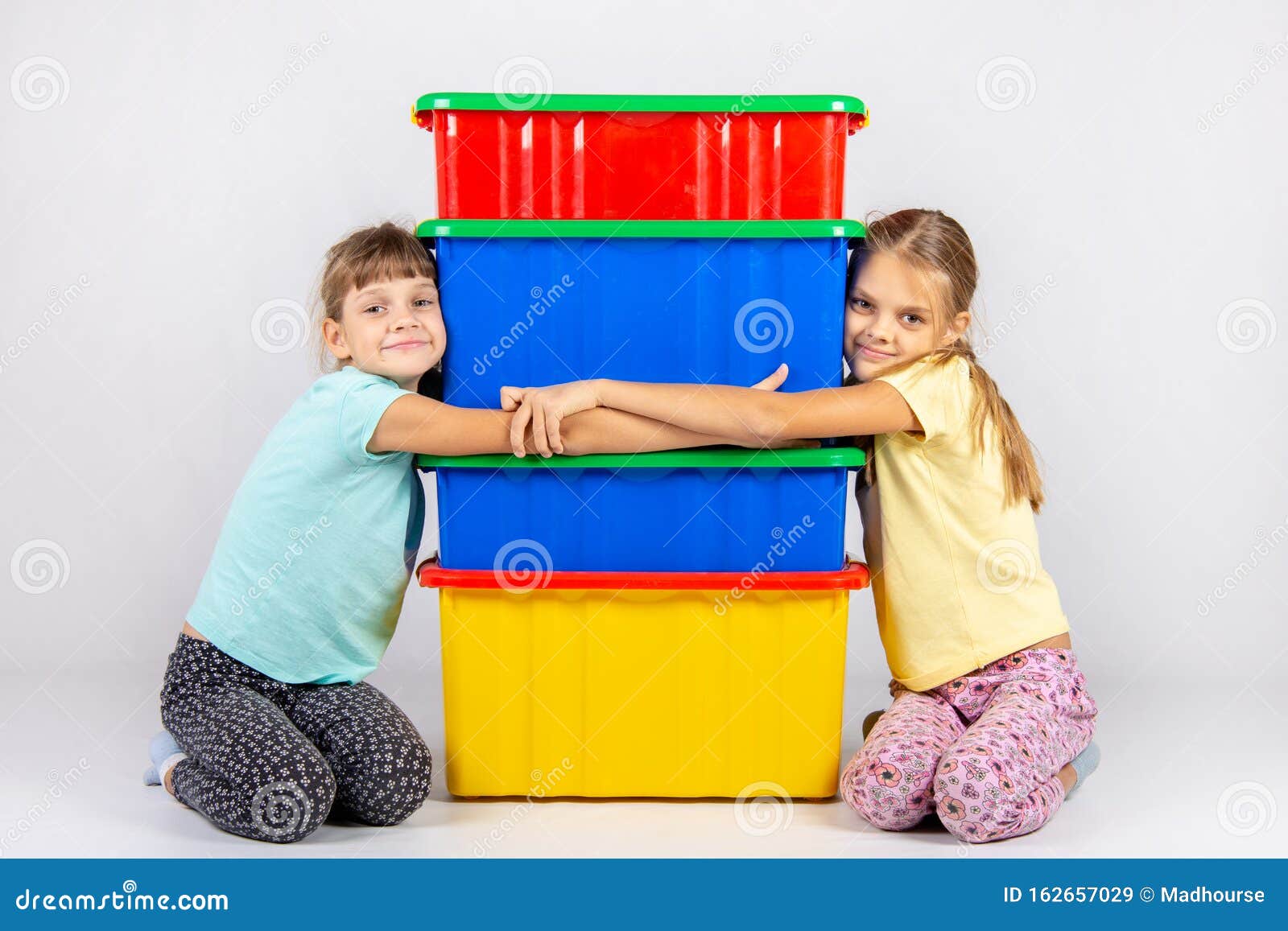 Two Girls Hug Big Plastic Boxes Stock Image - Image of play ...