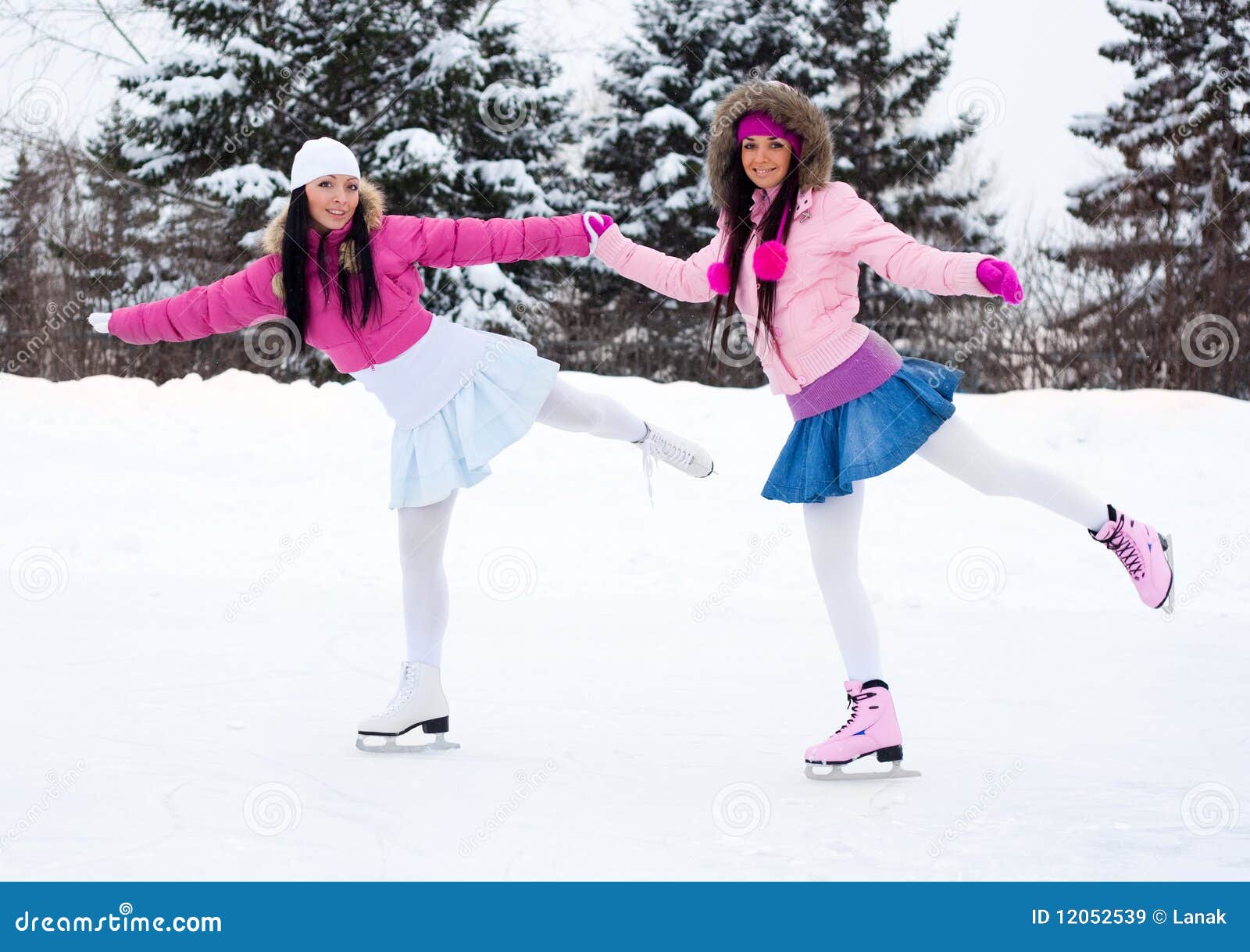 Two girls ice skating stock image. Image of casual, friendship - 12052539